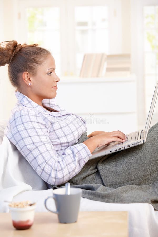 Young Woman Using Laptop in Bed at Home Stock Image - Image of focusing ...