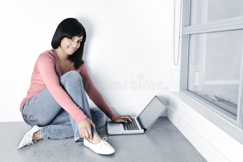 Young Woman Using Laptop Computer on Floor Stock Image - Image of mixed ...