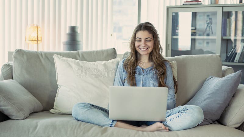 Young Woman Using Laptop Computer at Home Stock Image - Image of ...