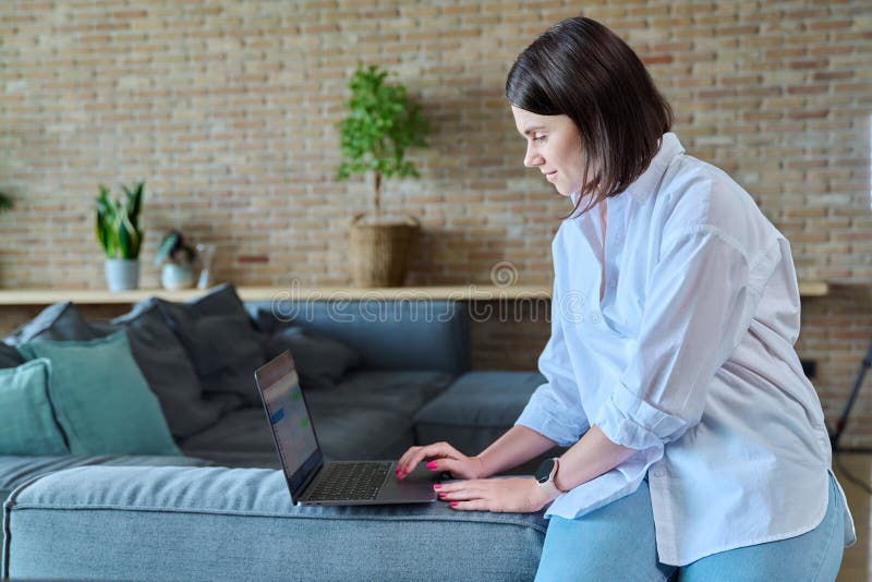 Young Woman Using Laptop for Online Communication Stock Photo - Image ...