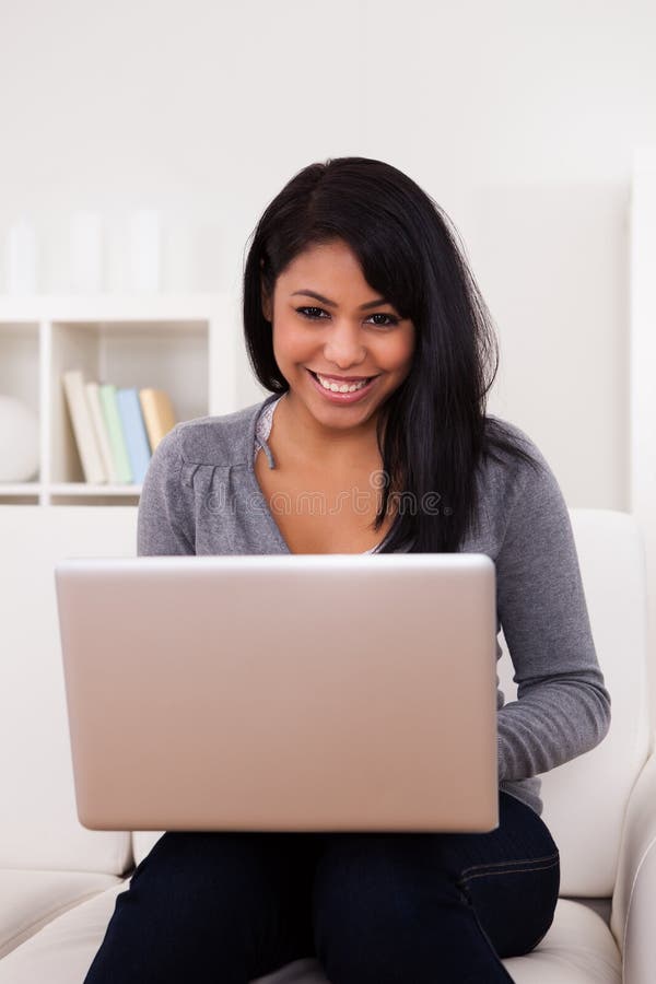 Young Woman Using Laptop stock image. Image of american - 57201281