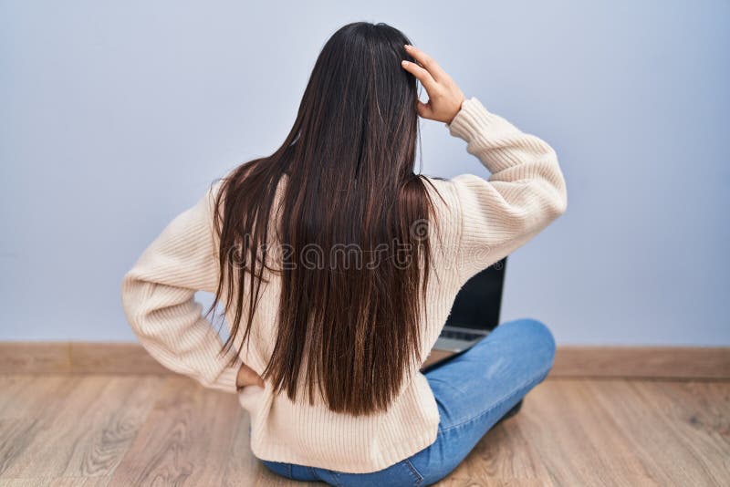 Young Woman Using Laptop Sitting on the Floor at Home Backwards ...