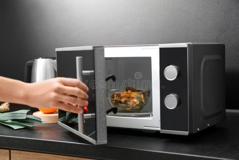 142 Woman Using Microwave Oven Kitchen Stock Photos - Free & Royalty ...