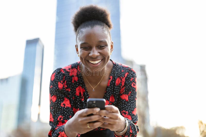 Young Woman Using Mobile Phone in the City Stock Image - Image of ...
