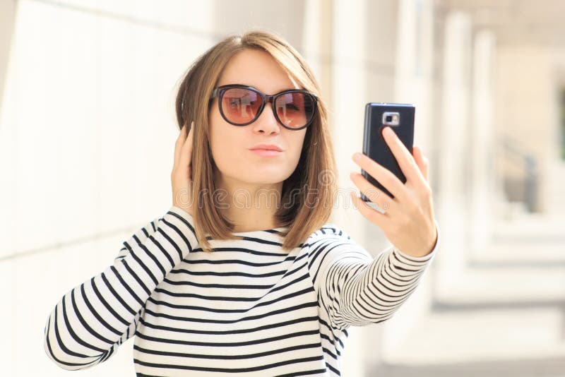 Young Woman Using Mobile Phone Taking Selfie Picture Self Portrait