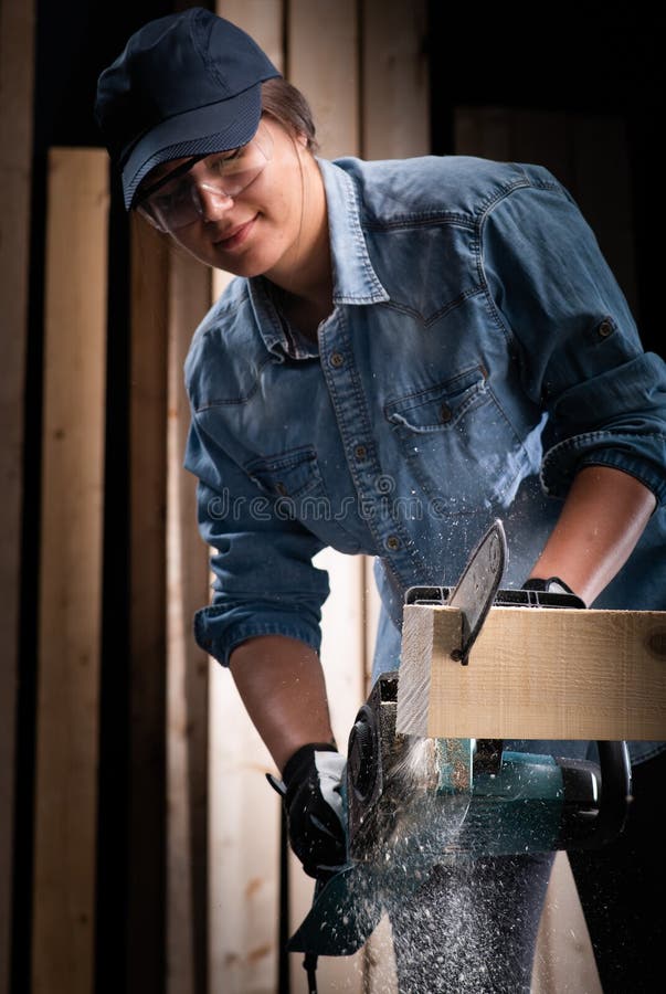 Young Woman Using Modern Electric Saw in the Workshop Stock Image ...