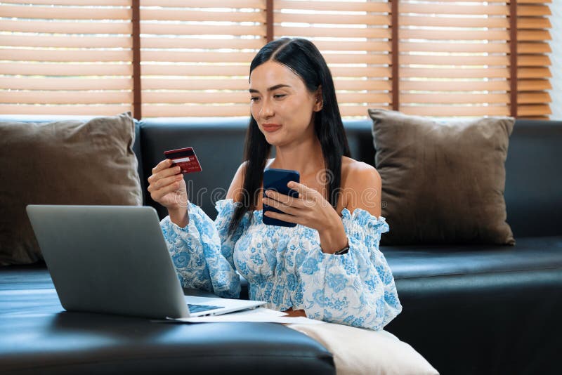 Young Woman Using Laptop, Happily Browsing the Internet at Home. Blithe ...