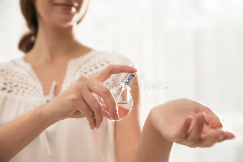 Young Woman Using Perfume Indoors Stock Image - Image of fragrance ...