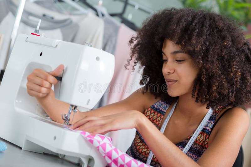 Young Woman Using Sewing Machine Stock Photo - Image of fashion, hobby ...