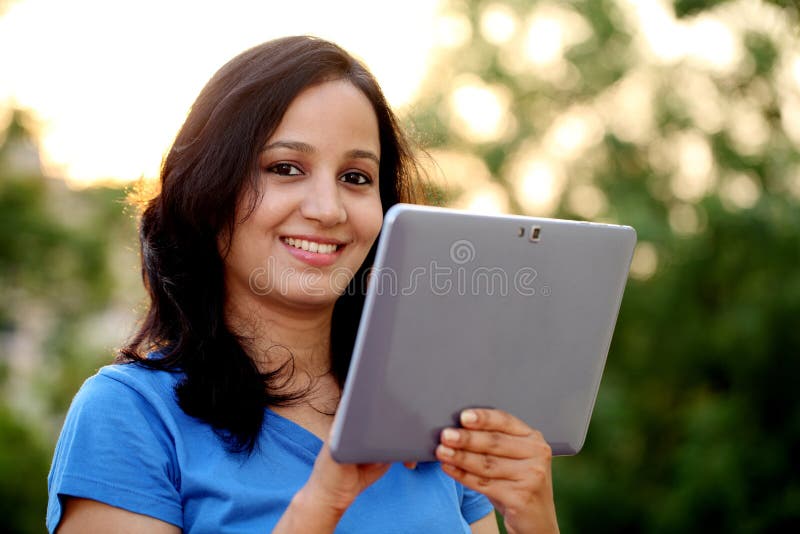 Young Woman Using Tablet Computer at Outdoor Stock Image - Image of ...