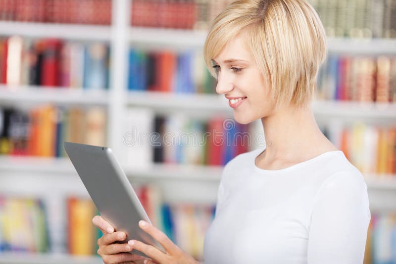 Young Woman Using Tablet-pc in Library Stock Photo - Image of digital ...