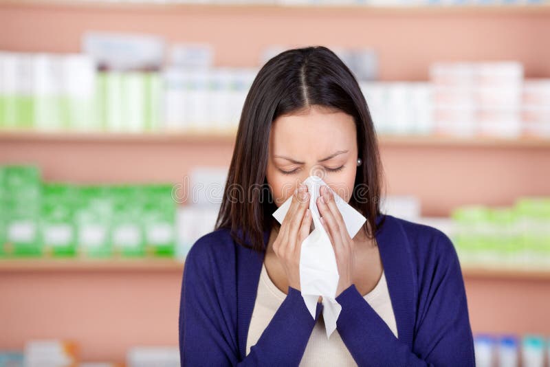 Young Woman Using Tissue in Pharmacy Stock Image - Image of pharmacy ...