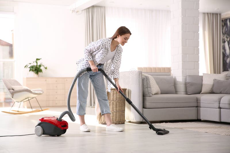 Young Woman Using Vacuum Cleaner Stock Image - Image of dust, electric ...