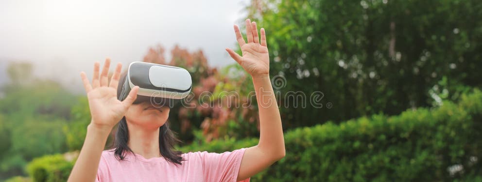 Young Woman Using Virtual Reality Headset Outdoors, Exploring Immersive ...