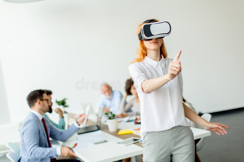 Young Woman Using Virtual Reality Simulator in the Office Stock Image ...