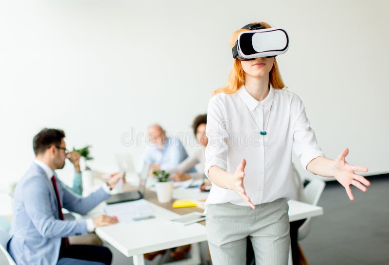Young Woman Using Virtual Reality Simulator in the Office Stock Image ...