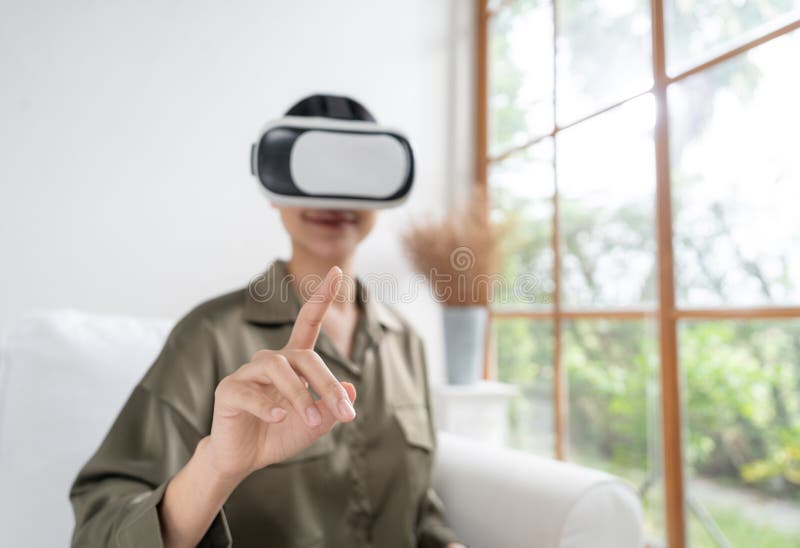 Young Woman Using Virtual Reality VR Goggle at Home for Uttermost ...