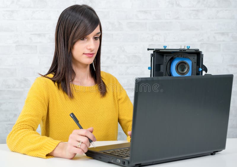 Woman Video Editor and Young Assistant Using Graphic Tablet Stock Photo ...