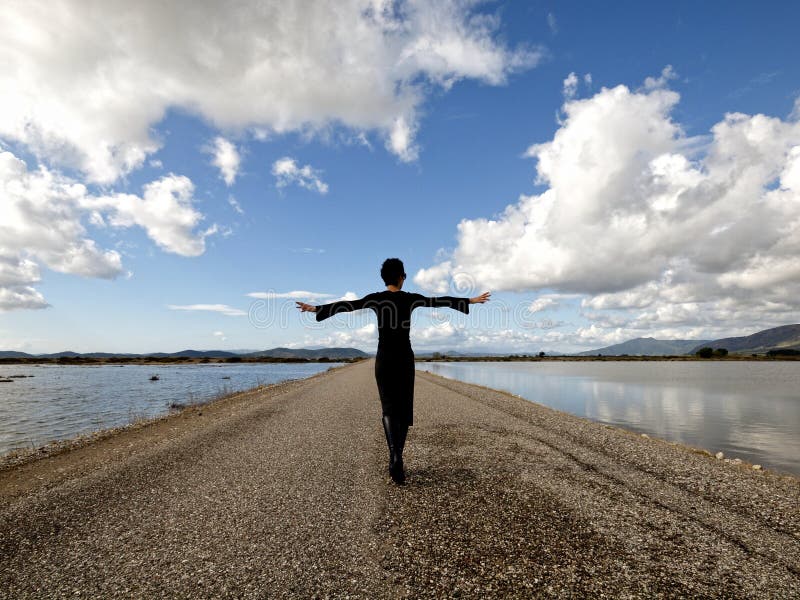 Young Woman Walking by the Sea Stock Photo - Image of beautiful ...