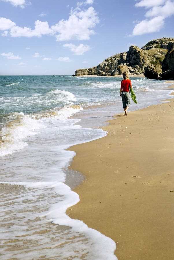 Young Woman Walking on a Beach Stock Photo - Image of dusk, beach: 61398992