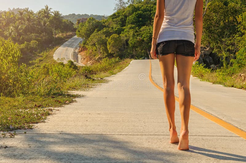 Young Woman Walking on Highway Stock Image - Image of life, girl: 85224823