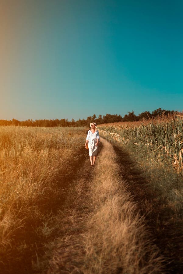 Young Woman Walking on Rural Road Stock Image - Image of people ...