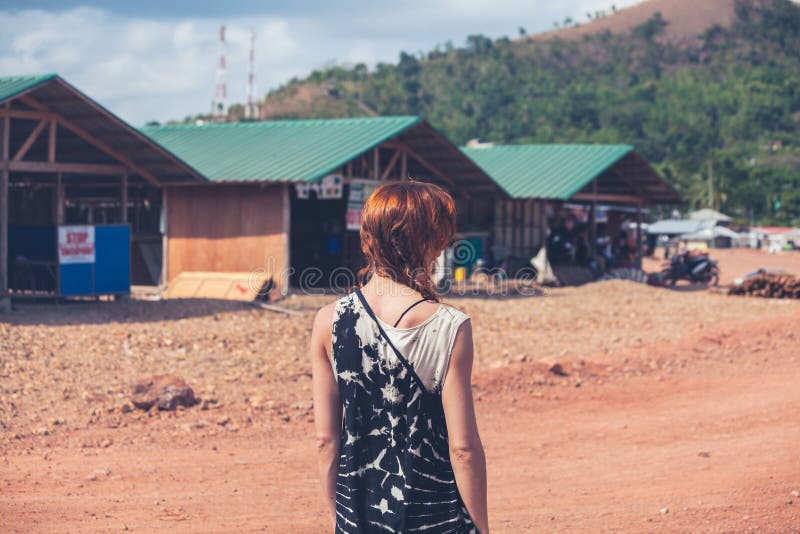 Young Woman Walking in a Small Town in Developing Country Stock Photo ...