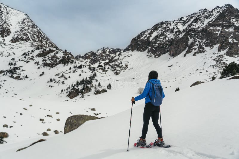 Young Woman Walking with Snow Rackets in High Mountain Stock Image ...