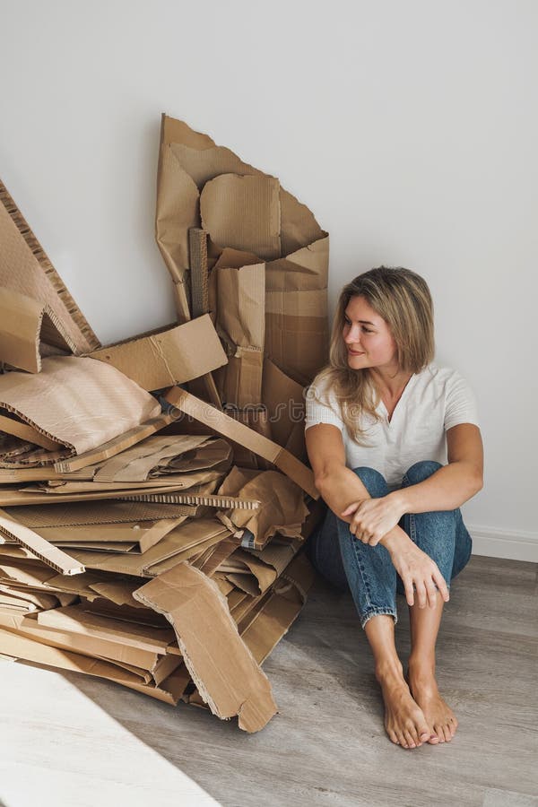 Young Woman Wand Stack of Cardboard Waste at Home. Concepts of Paper ...