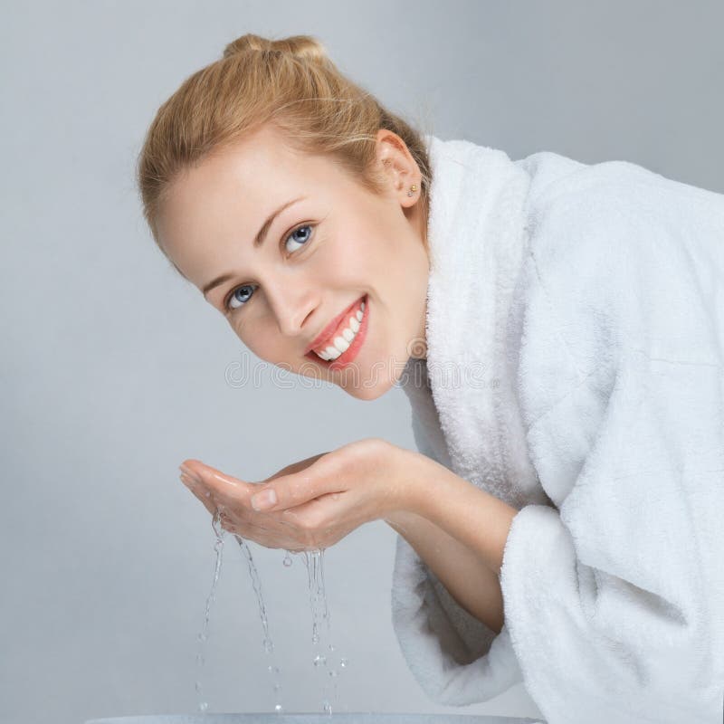 Young woman washing face stock photo. Image of human - 22713084