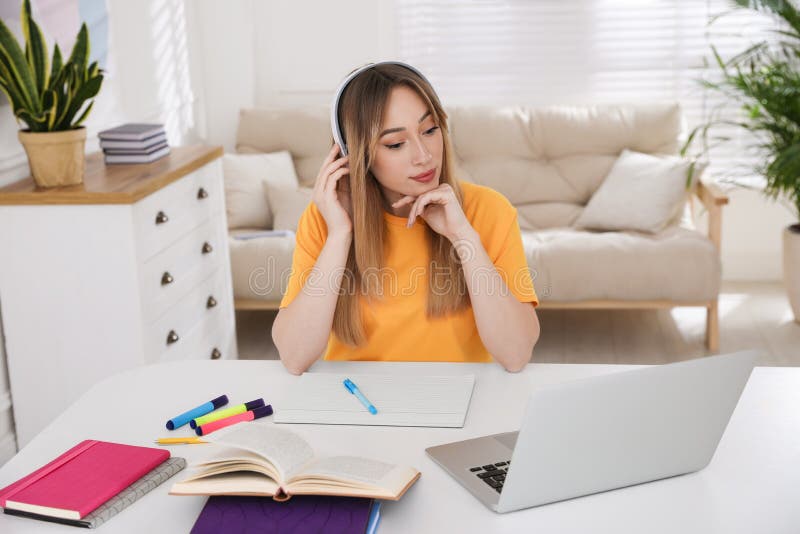 Young Woman Watching Webinar at Table in Room Stock Photo - Image of office, adult: 257931826