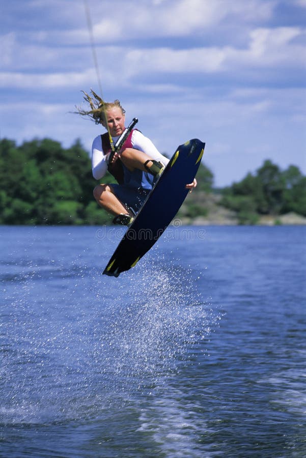 A young woman water skiing stock image. Image of watersports - 6077823