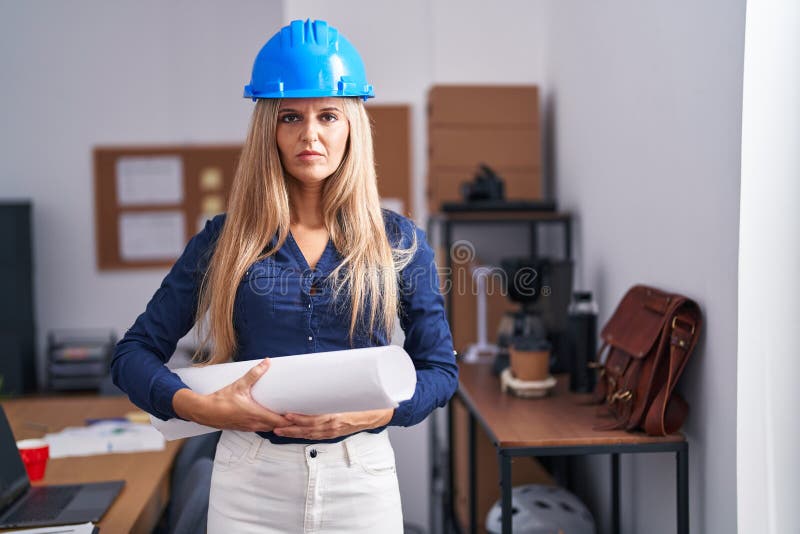 Young Woman Wearing Architect Hardhat Thinking Attitude and Sober ... Young Woman Wearing Architect Hardhat Thinking Attitude and Sober ...
