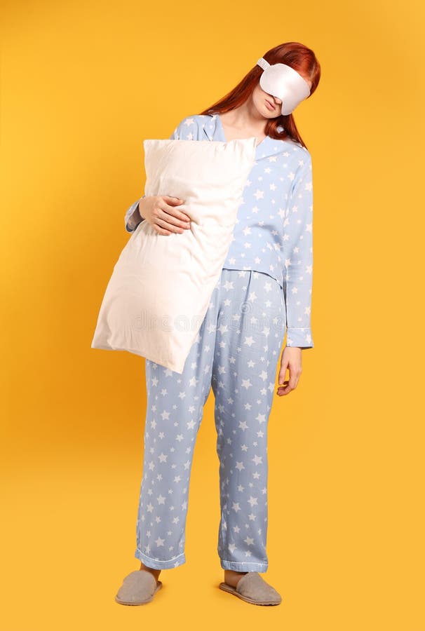 Young Woman Wearing Pajamas and Slippers in Sleepwalking State on White ... Young Woman Wearing Pajamas and Slippers in Sleepwalking State on White ...