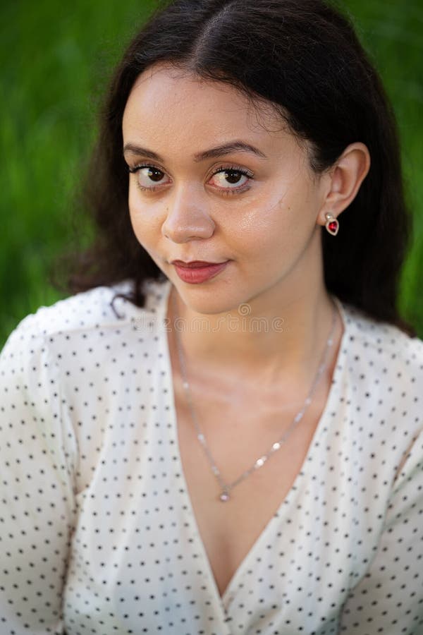 Young Woman in a White Dress Looking into the Camera Stock Photo ...