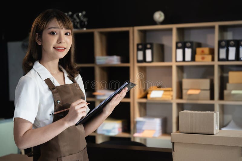 Young Woman Work in Back Office for Checking the Product in the ...