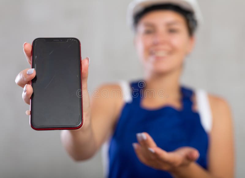 Young Woman in Work Overalls Posing with Phone Stock Image - Image of ...