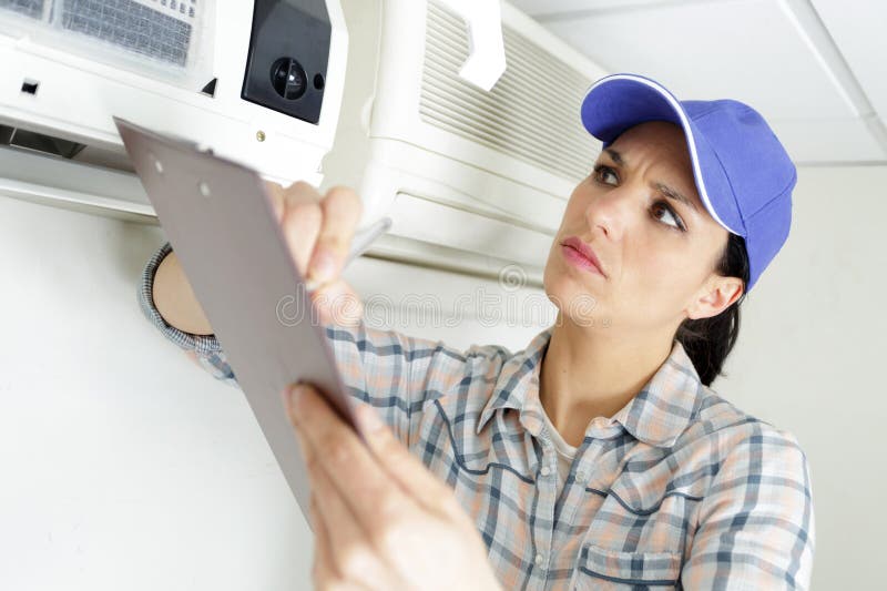 Young Woman Worker Installing Ac Stock Photo - Image of install, skill ...