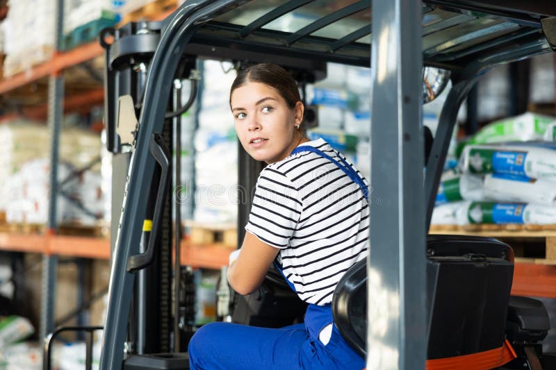 Young Woman Worker Working on Loader in Warehouse Stock Photo - Image ...