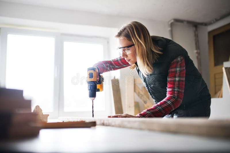 Young Woman Worker in the Carpenter Workroom. Stock Image - Image of ...