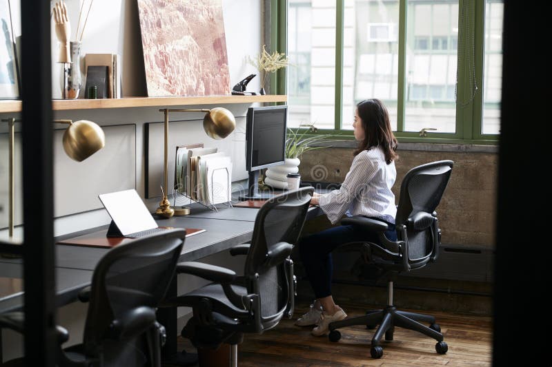 Young Woman Working Alone in a Compact Office Stock Image - Image of ...
