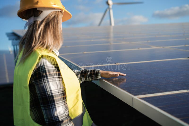 Young Woman Working at Alternative Energy Farm - Focus on Architect ...