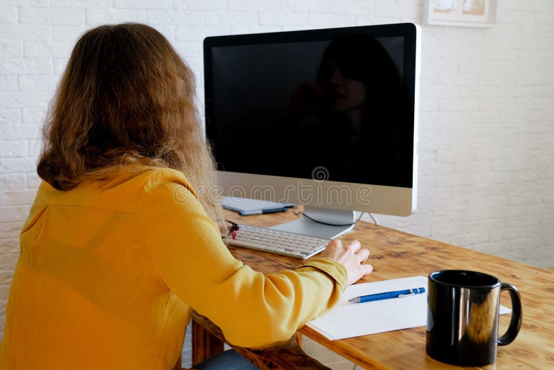 Young Woman Working on Computer. Back View. Stock Photo - Image of ...