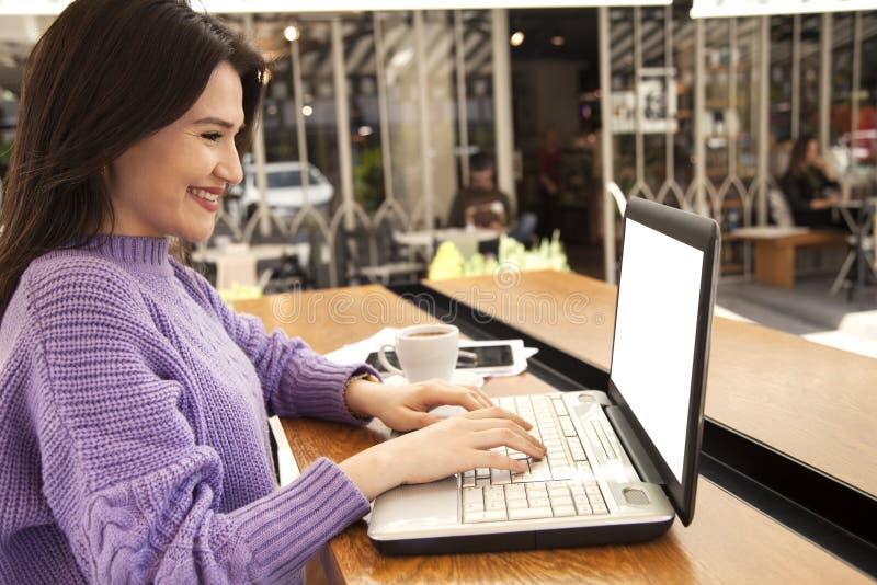 Young Woman is Working with Computer in Cafe Stock Image - Image of ...