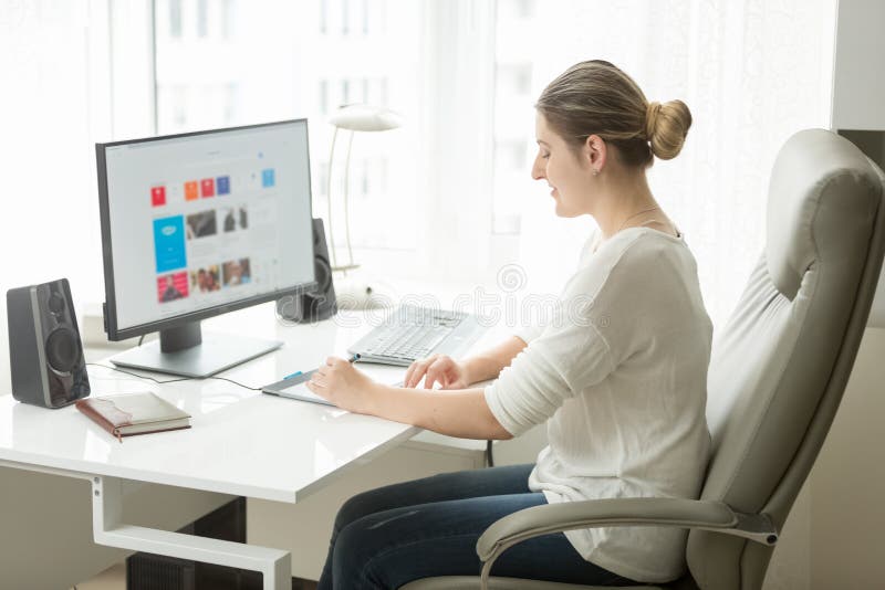 Beautiful Young Woman Working on Computer at Home Office Stock Photo ...
