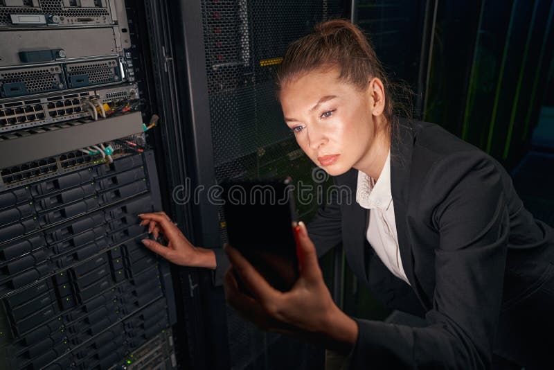 Young Woman Working on Data Center Using Cellphone Stock Image - Image ...