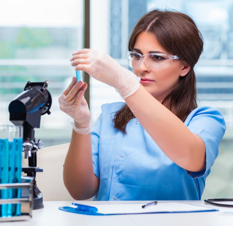 The Young Woman Working in the Laboratory Stock Image - Image of glass ...