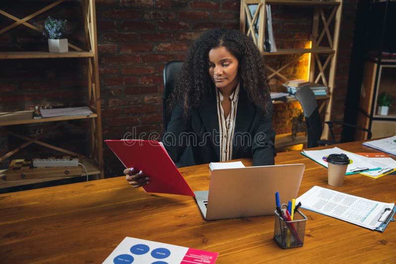 Young Woman Working in Modern Office Using Devices and Gadgets. Making ...