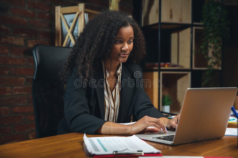 Young Woman Working in Modern Office Using Devices and Gadgets. Making ...