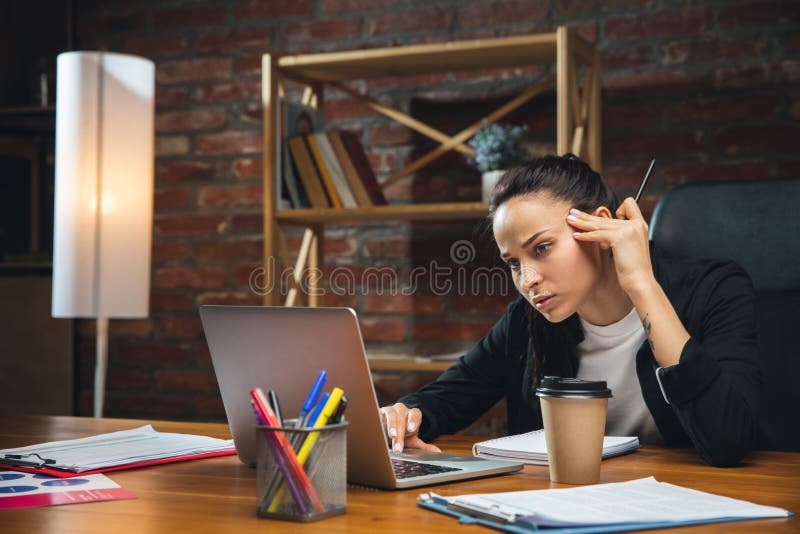 Young Woman Working in Modern Office Using Devices and Gadgets. Making ...